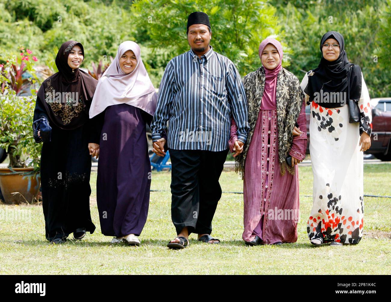 In this Aug. 15, 2009 photo, polygamist Mohammad Inaamulillah Bin ...