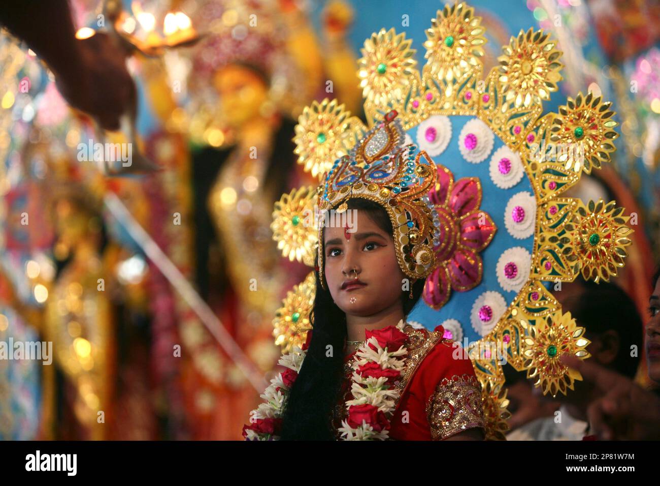 A Bangladeshi Hindu girl Modhumonjuri dressed as Kumari, or living ...