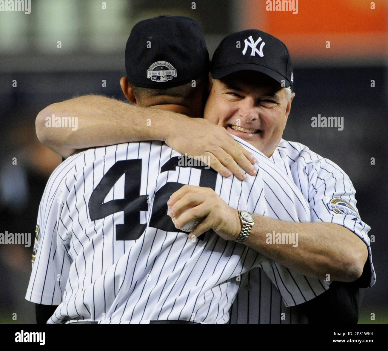 Panama President Ricardo Martinelli receives a hug from Mariano Rivera ...