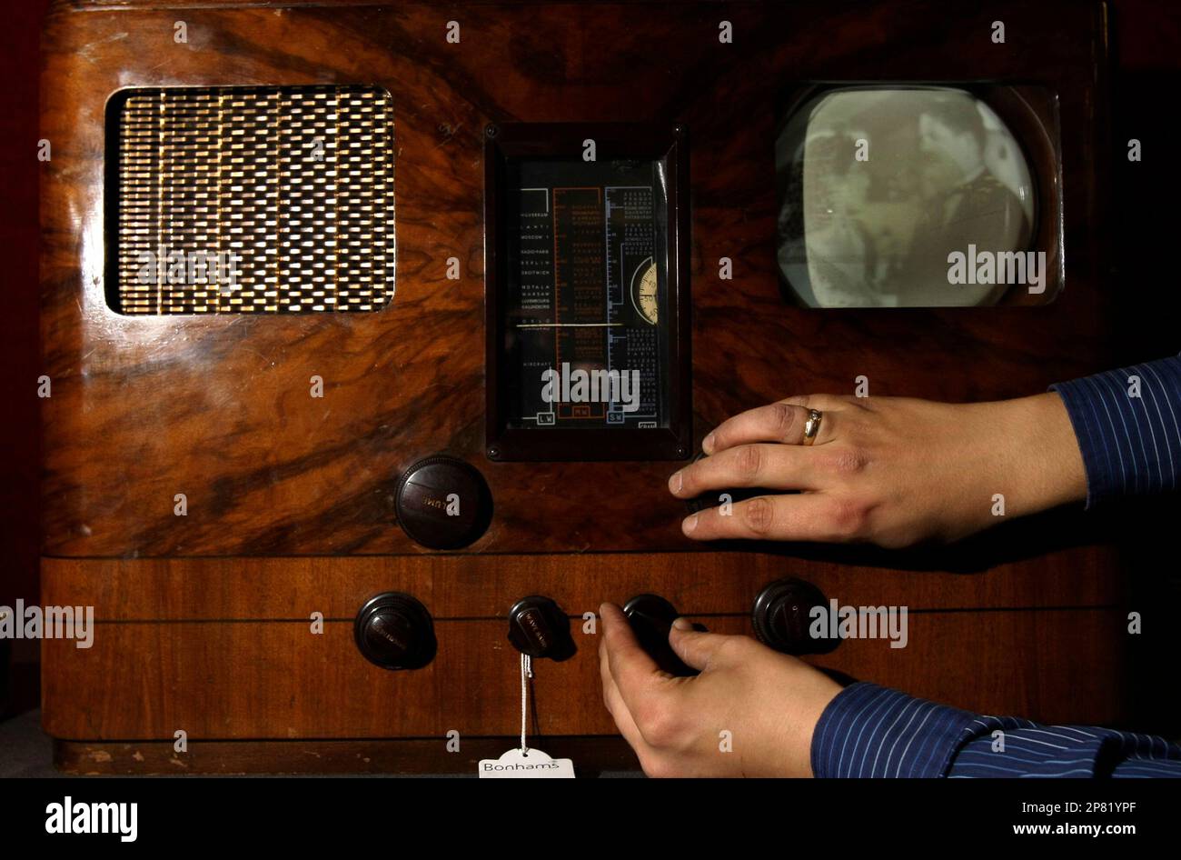 A Bonhams employee moves one of the controls of a HMV 7 inch 1938 ...