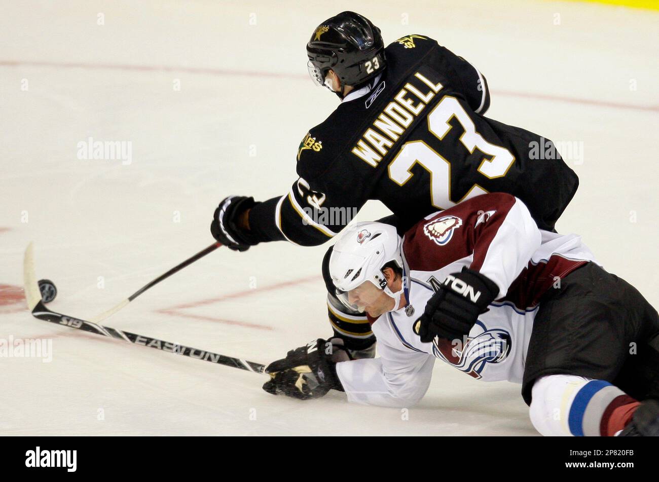 Dallas Stars center Tom Wandell (23), of Sweden, is knocked down by ...