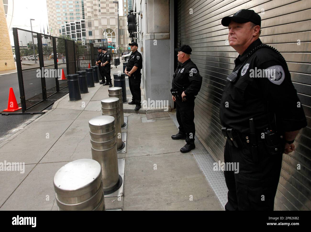 Federal Reserve Bank Police stand guard outside of the bank as security ...