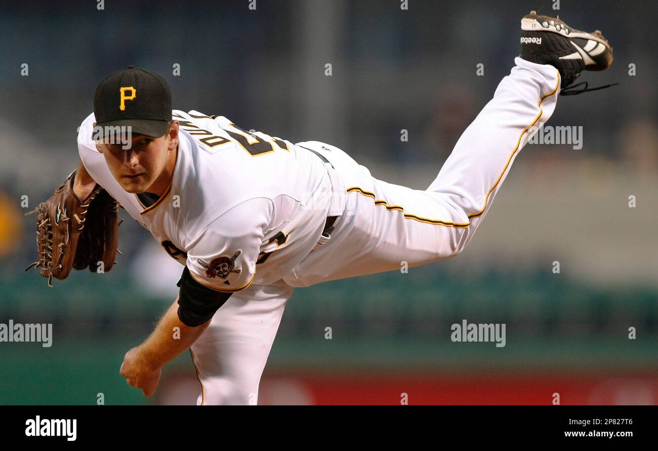 Pittsburgh Pirates' Zach Duke follows through on a pitch against the ...