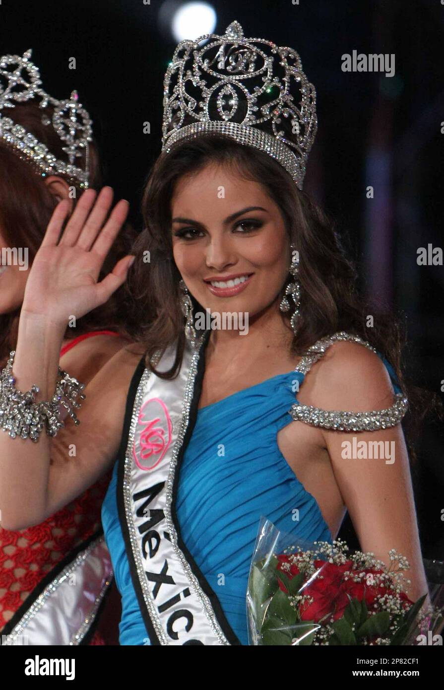 Jimena Navarrete, from the Mexican State of Jalisco, waves after ...