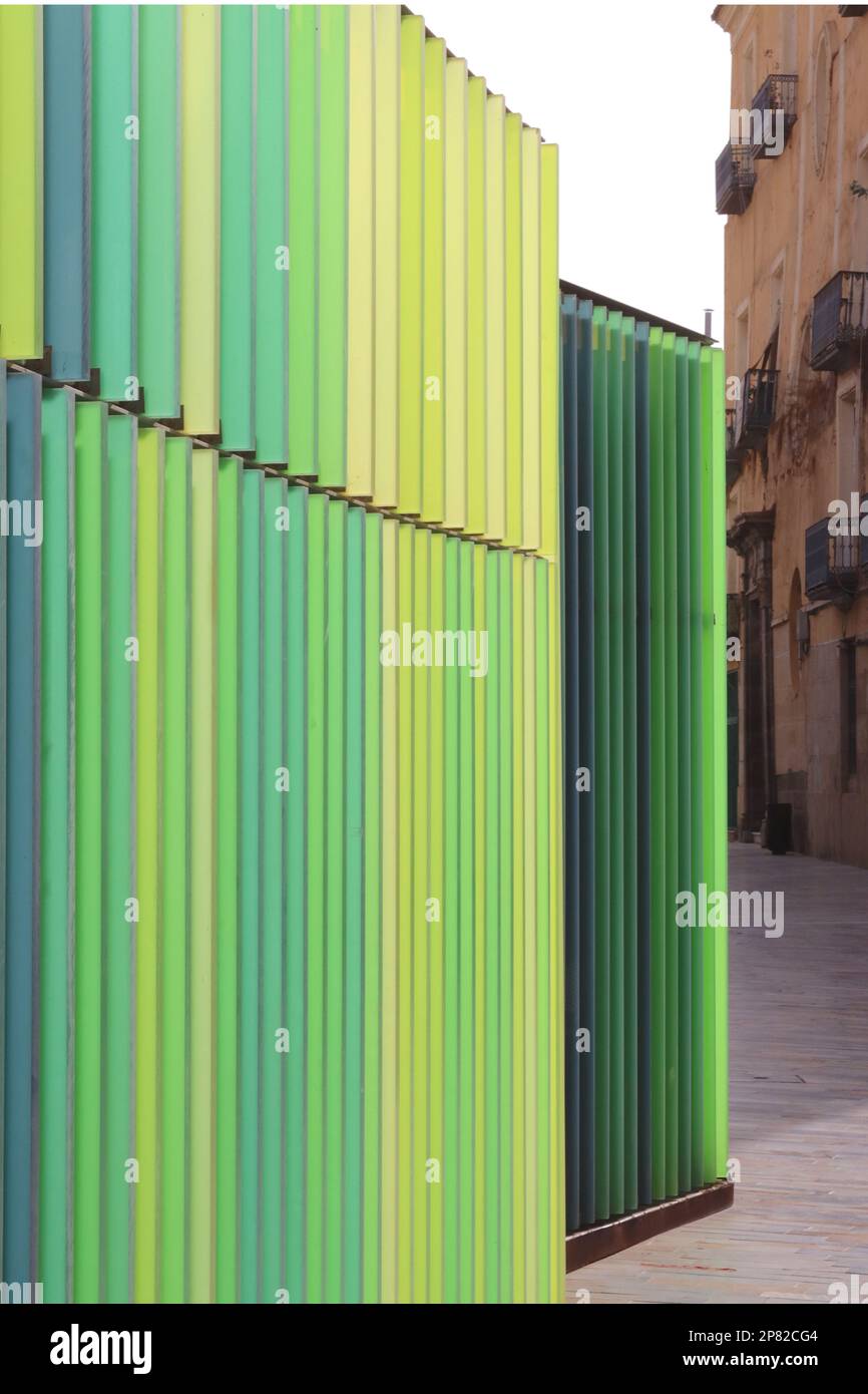 Hoarding panels, made up of different shades of green frosted glass ...
