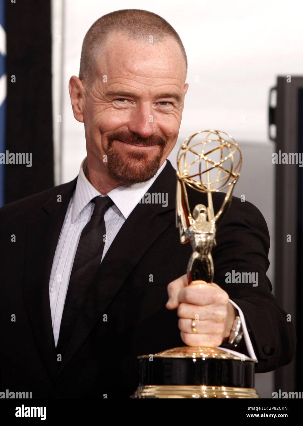 Actor Bryan Cranston poses with his award for outstanding actor in a ...