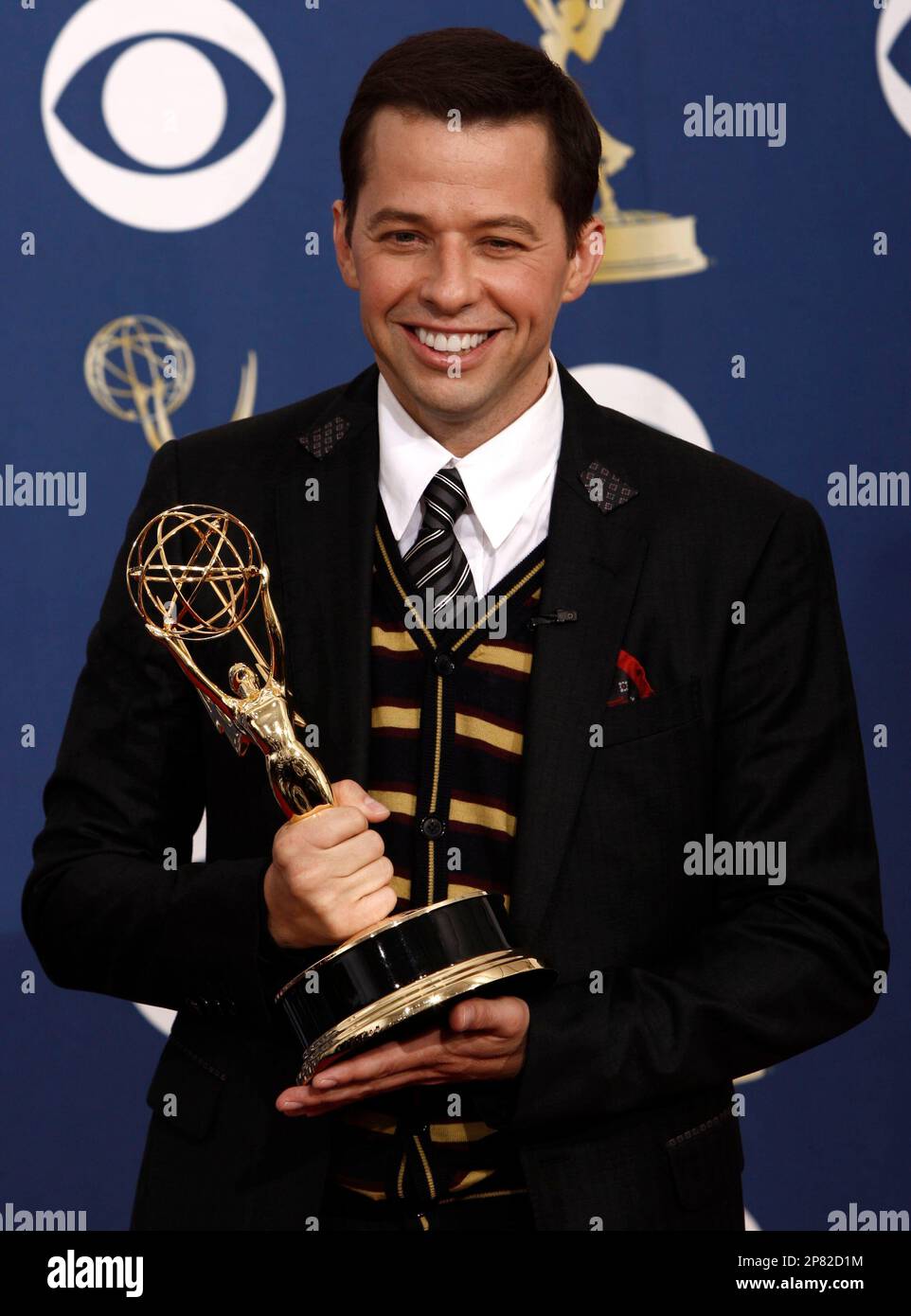 Jon Cryer is seen backstage with the award for best supporting actor in ...