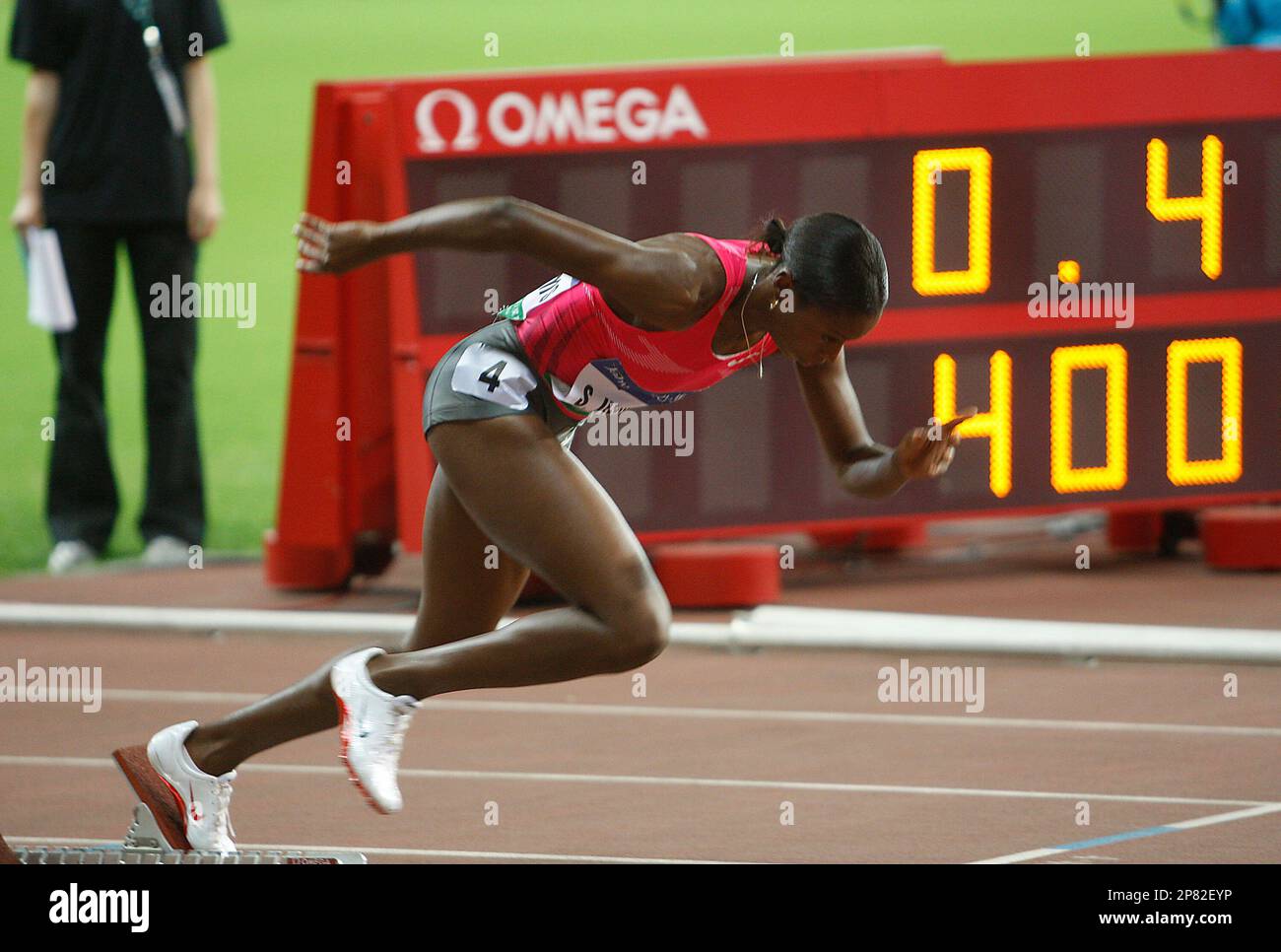 Shericka Williams of Jamaica dashes during the women's 400 metres race ...