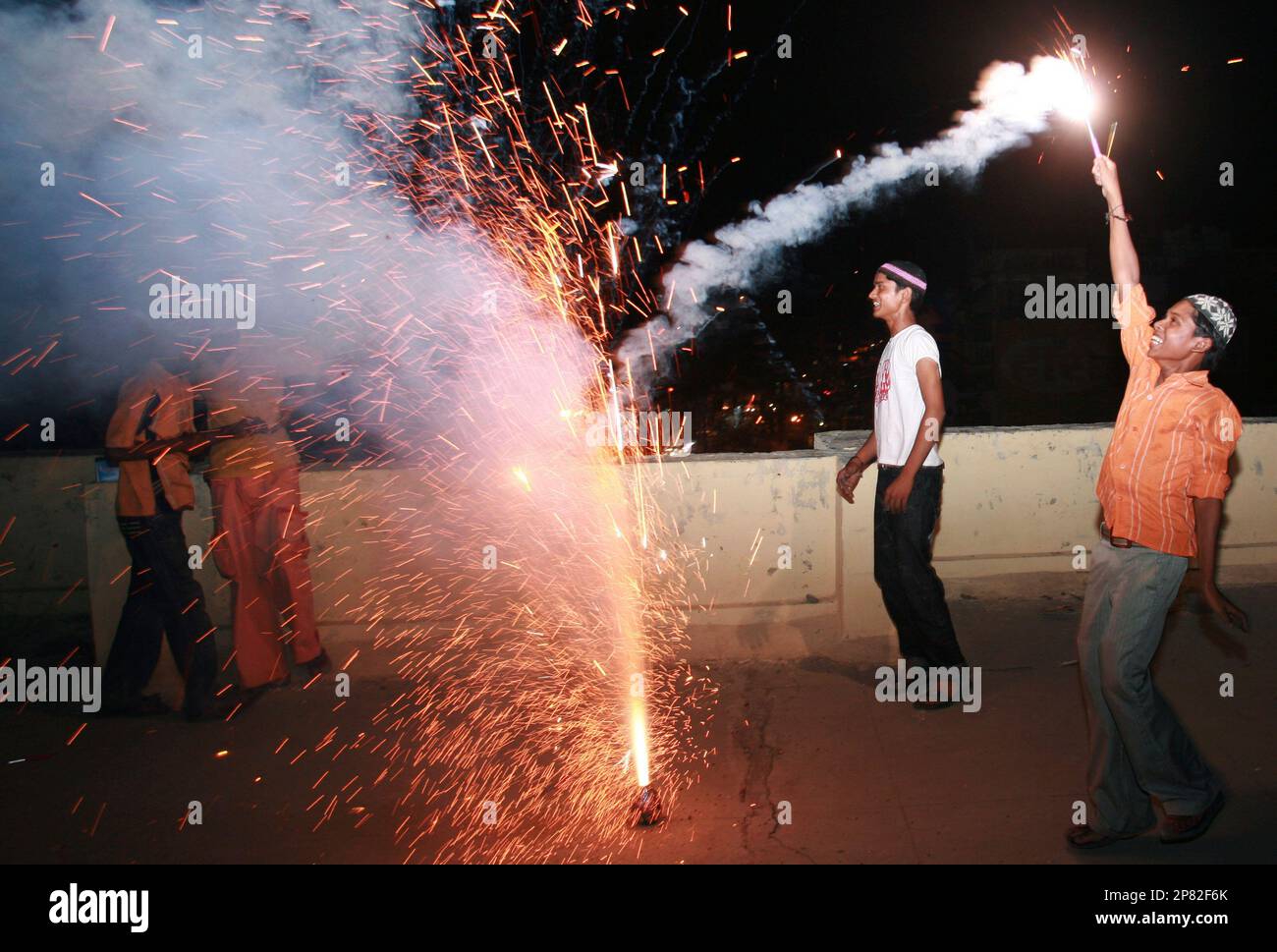 Muslims burn fire crackers after seeing the moon in Allahabad, India ...