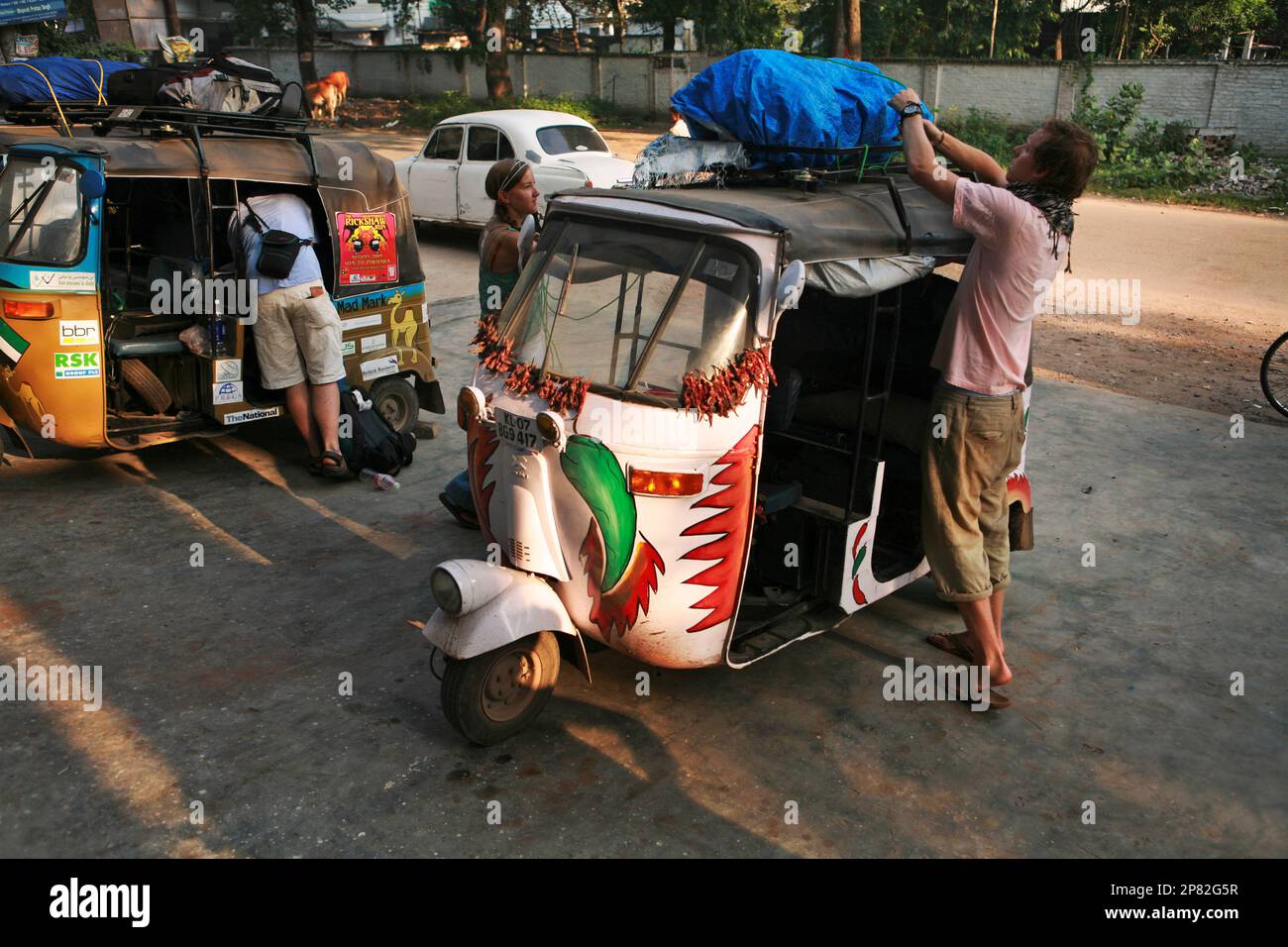 Nick Wade of UK, a member of "Some Like It Hot" team, loads his luggage ...