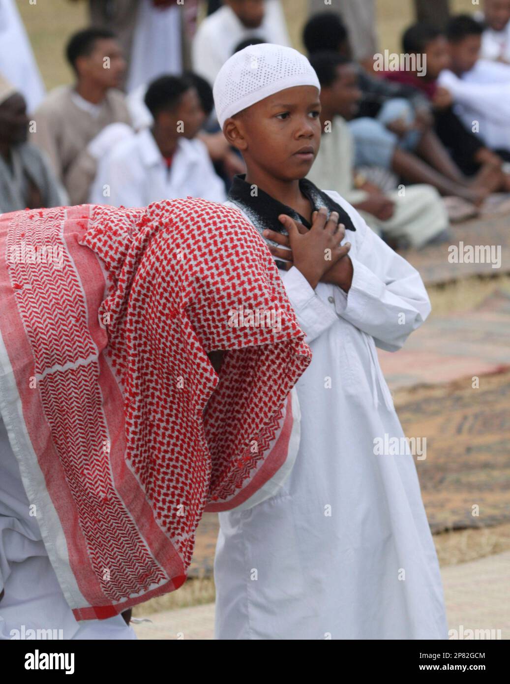 A young Muslim boy joins hundreds of Kenyan Muslims who gathered at an ...
