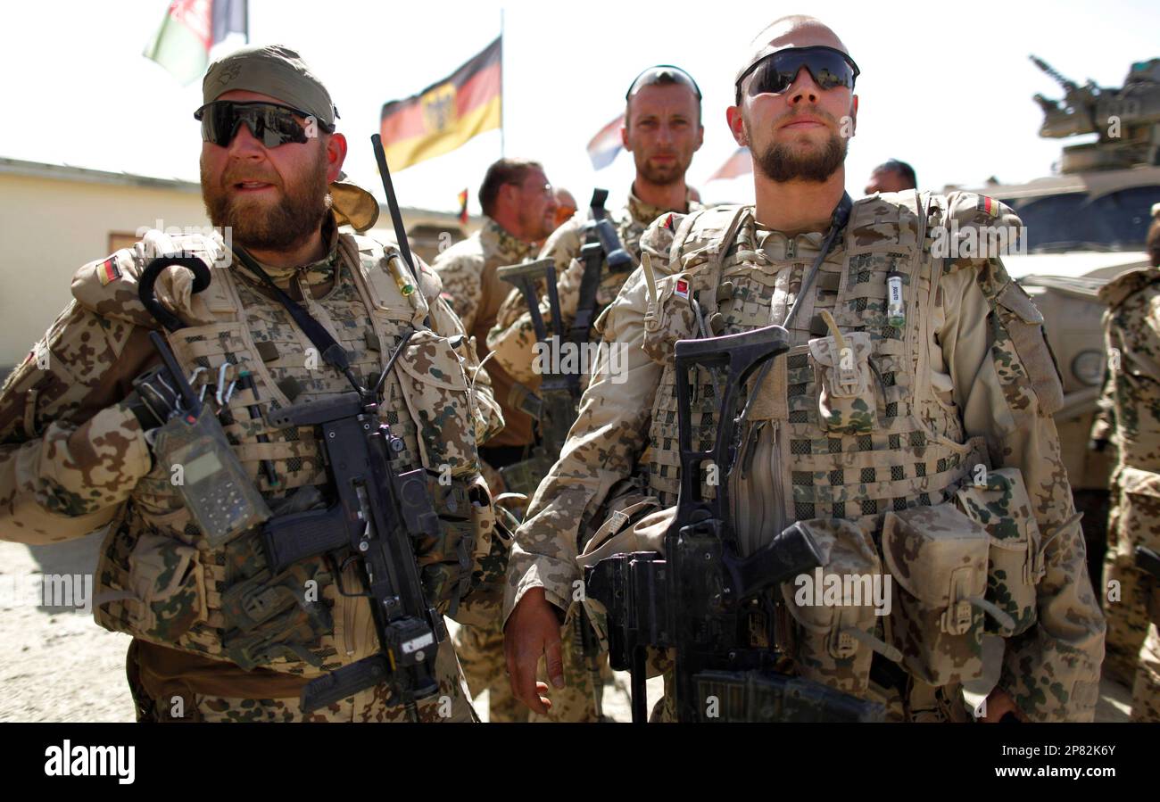 German ISAF soldiers arrives back to the base after patrolling with ...