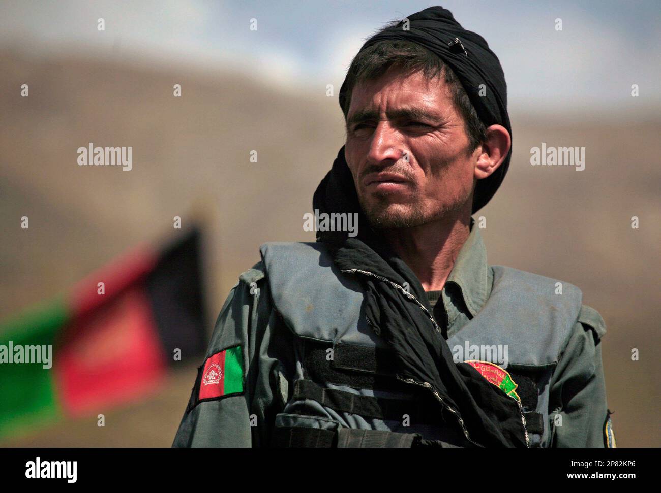 An Afghan National Police officer is seen during a training session ...