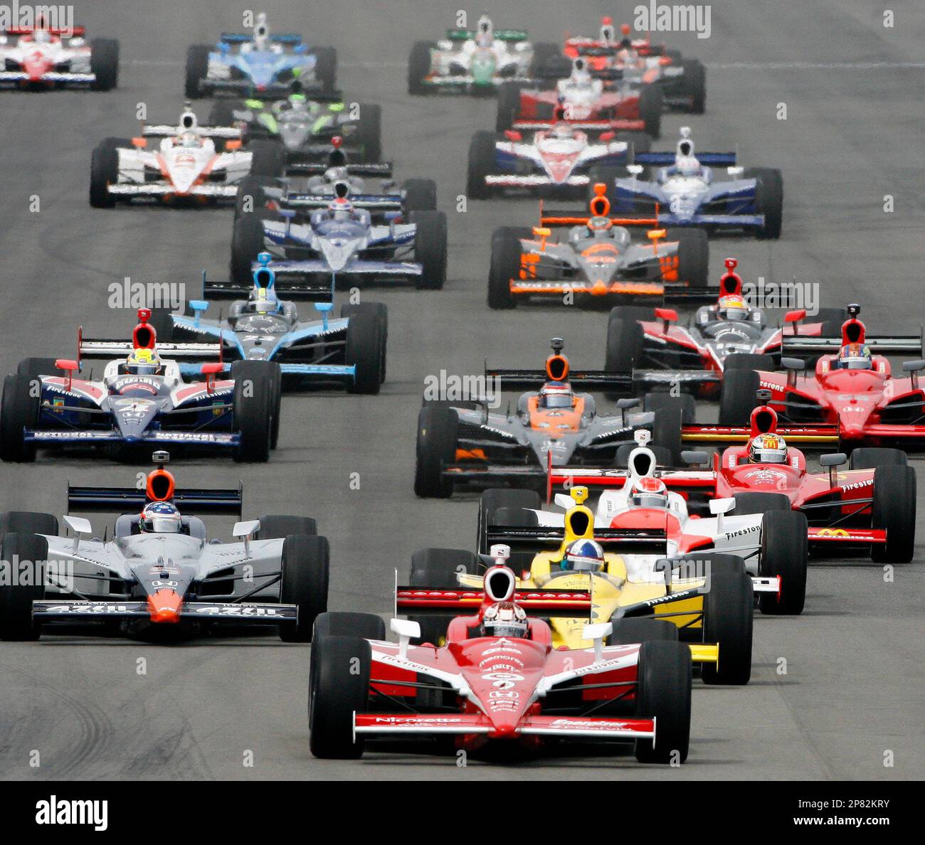Scott Dixon of New Zealand leads the pack shortly after the start of ...