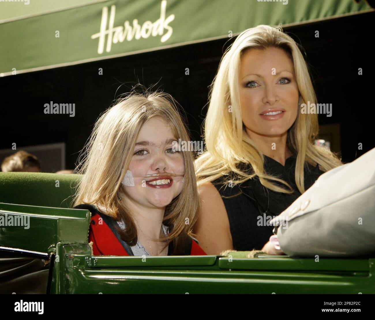British model Caprice, right, arrives at Harrods department store in ...