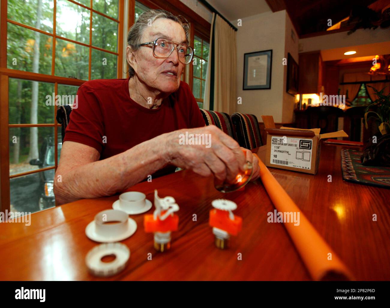 Country singer and sausage icon, Jimmy Dean, looks over sprinklers that ...