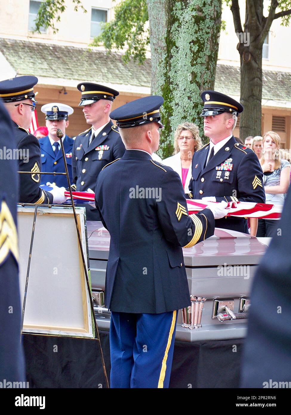 Soldiers fold a flag over the casket of U.S. Army 1st Lt. Tyler Parten ...