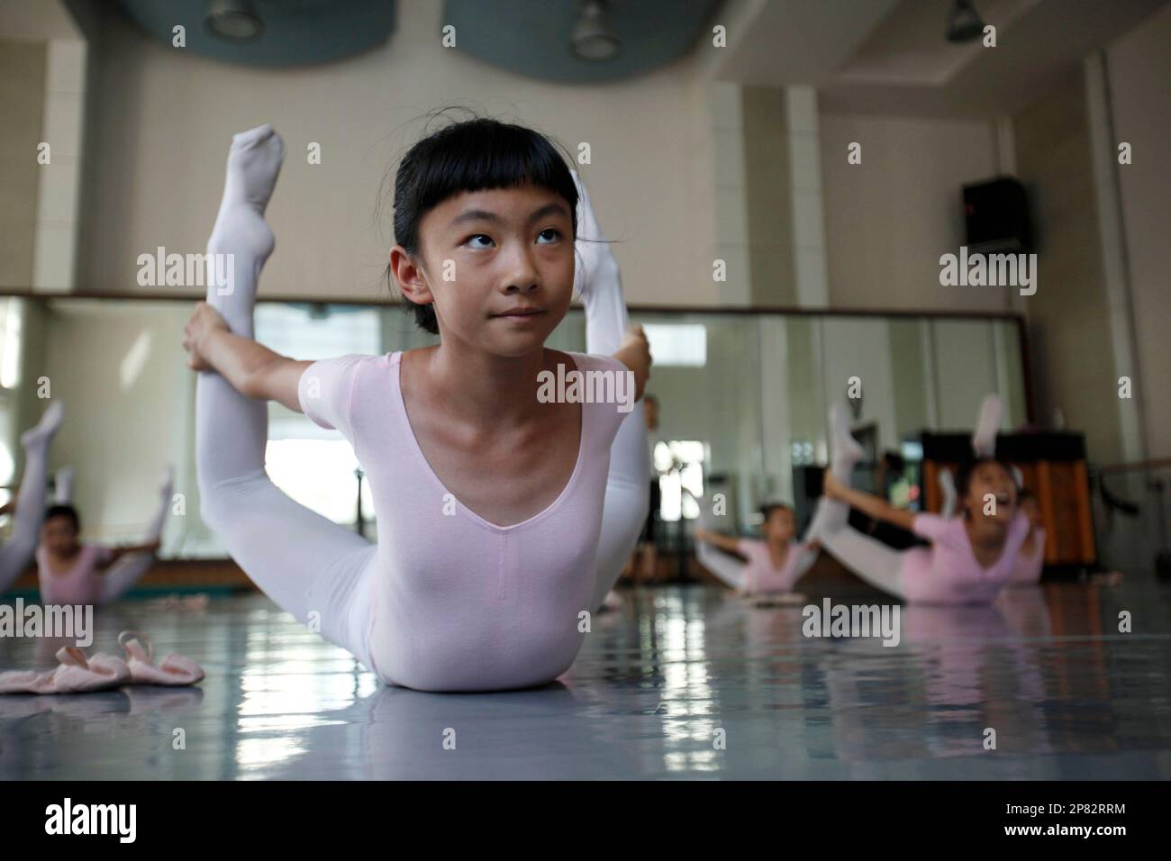 In this photo taken Aug. 29, 2009, young dancers take ballet lessons at ...