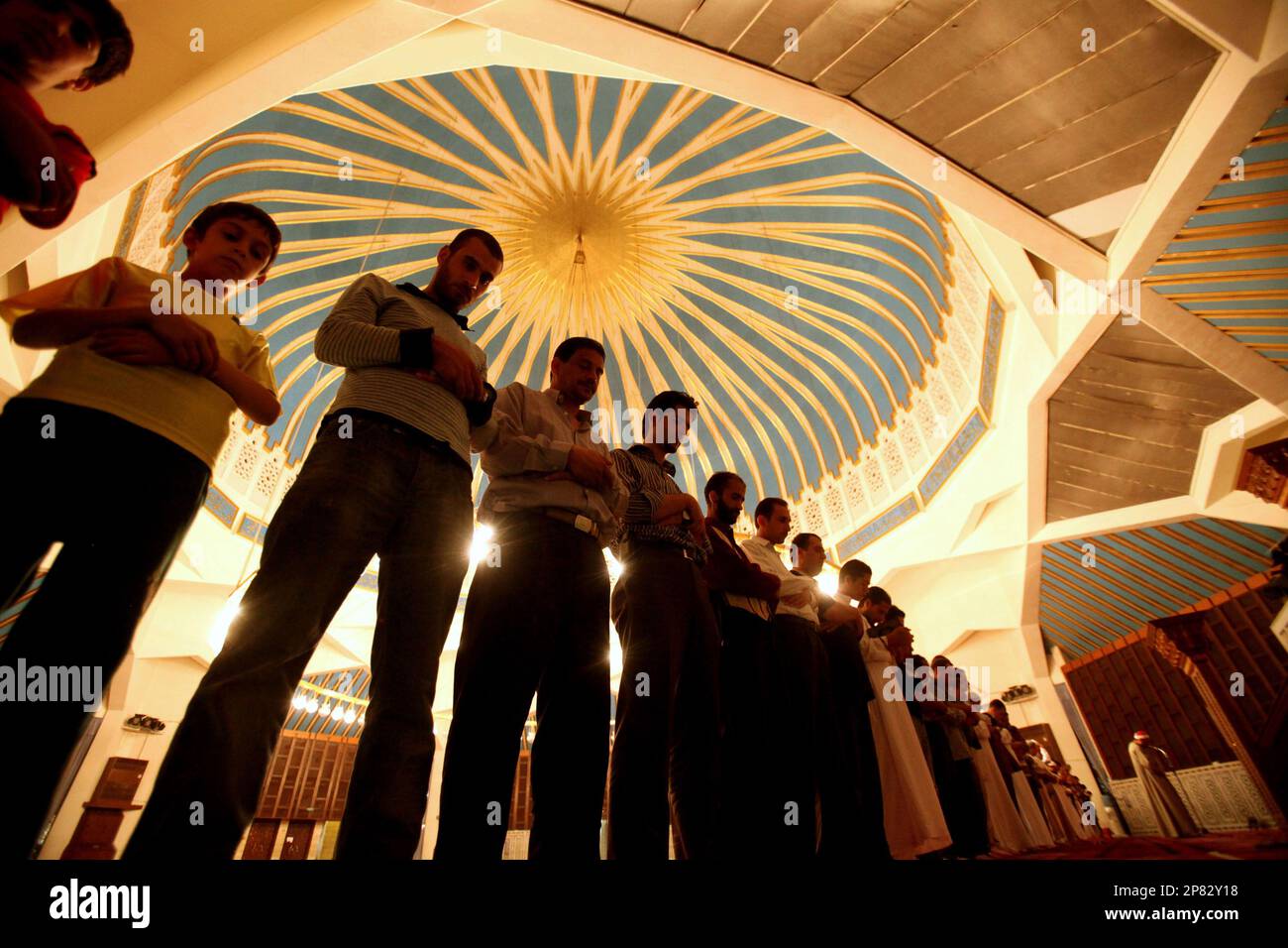 Jordanian worshipers are seen praying in a mosque in Amman, at the dawn ...