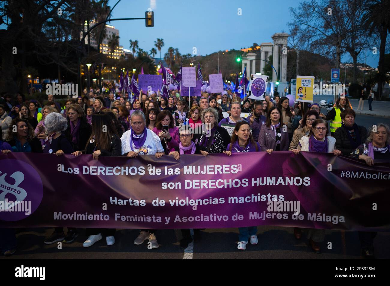 Malaga, Spain. 08th Mar, 2023. Women are seen holding a large banner as ...