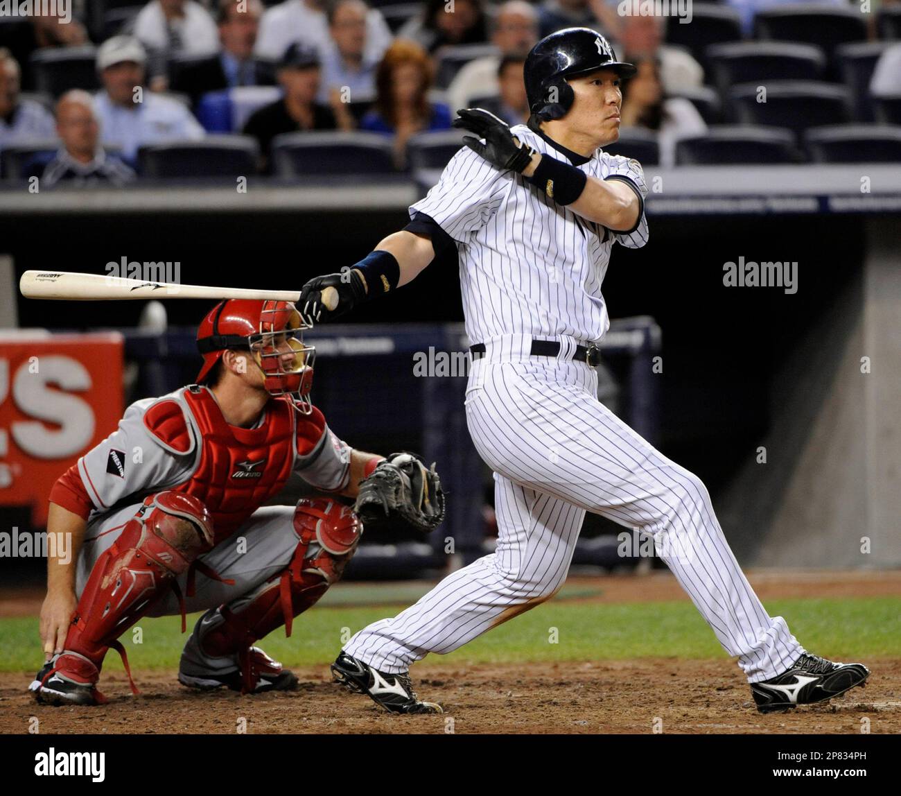 New York Yankees' Hideki Matsui follows through on a single as Los ...