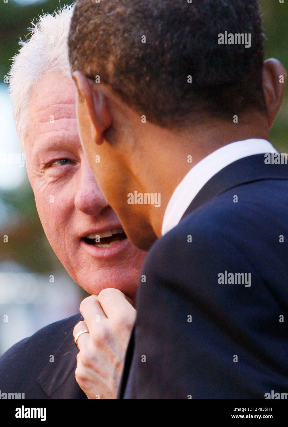 President Barack Obama talks with former President Bill Clinton after ...
