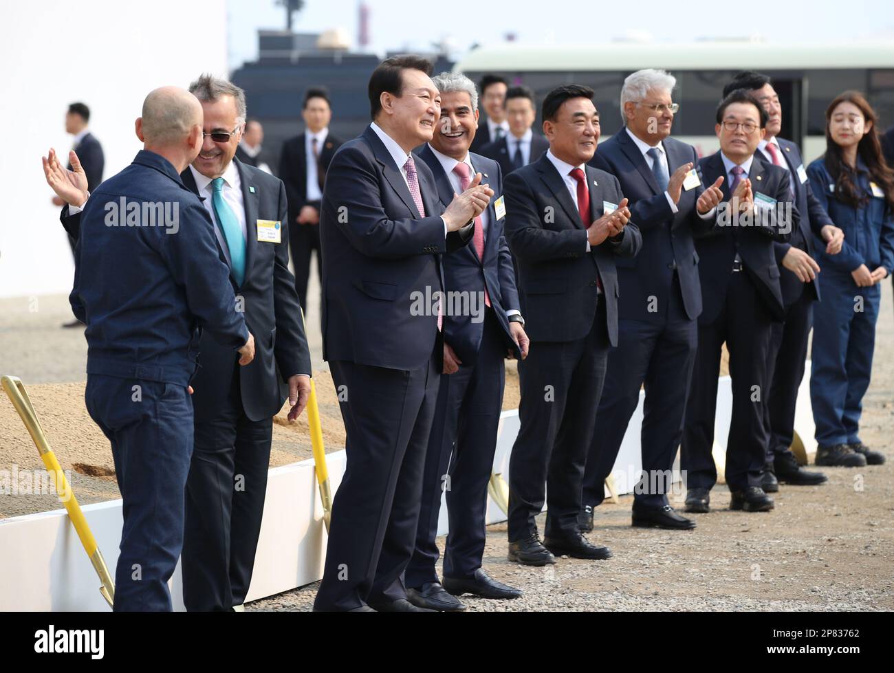 Groundbreaking ceremony for petrochemical plant President Yoon Suk Yeol (3rd from L) talks with ...