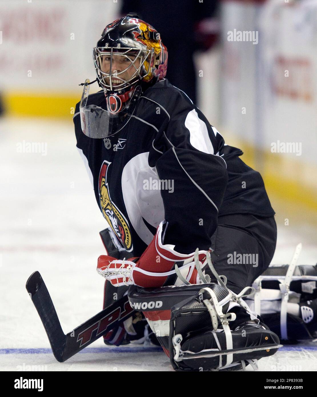 Ottawa Senators goalie Pascal Leclaire stretches at the start of ...