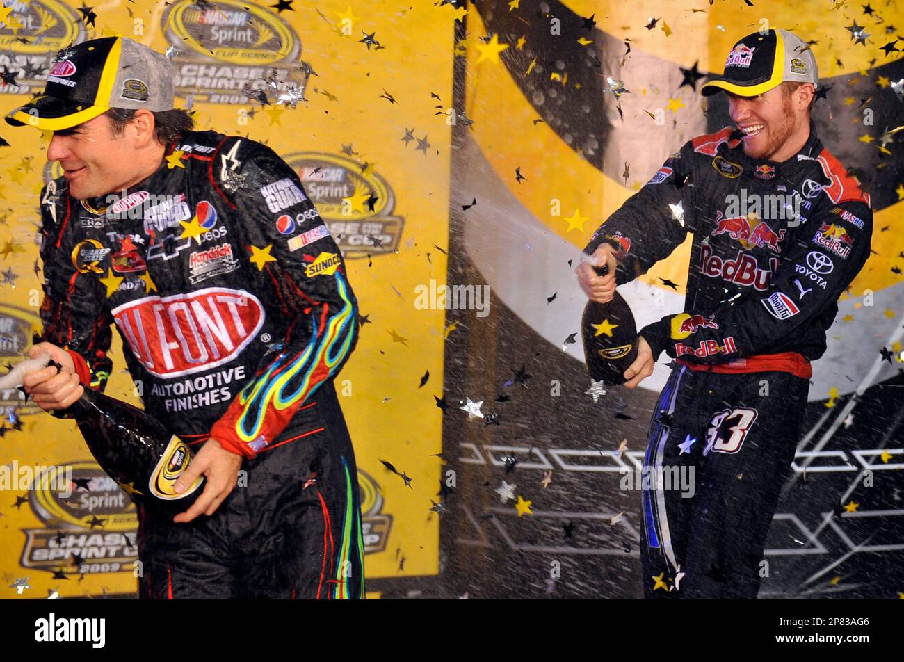 Brian Vickers, right, sprays champagne on Jeff Gordon after the NASCAR ...