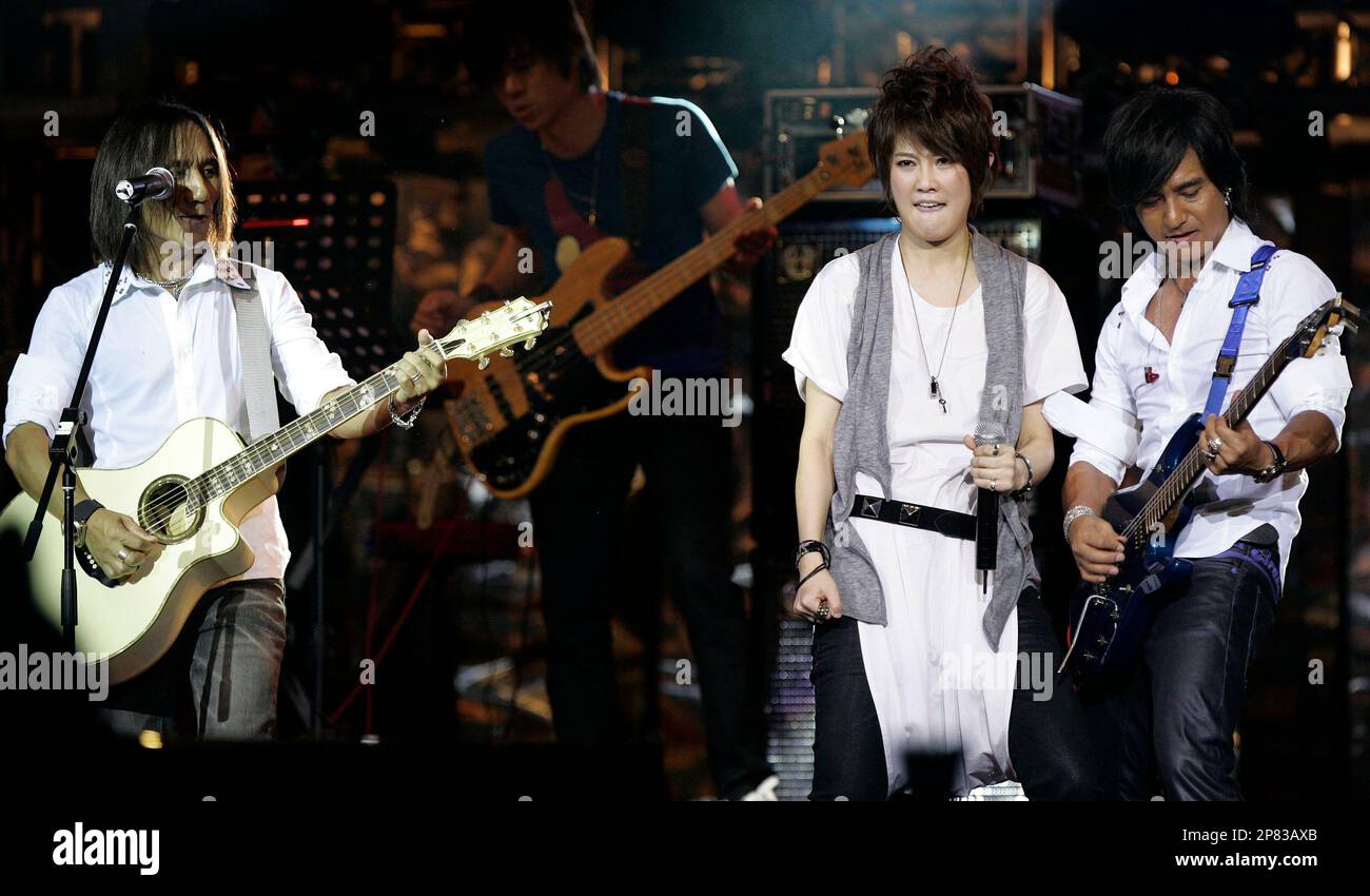 Chinese singer Liu Liyang, second right, performs with Taiwanese rock ...