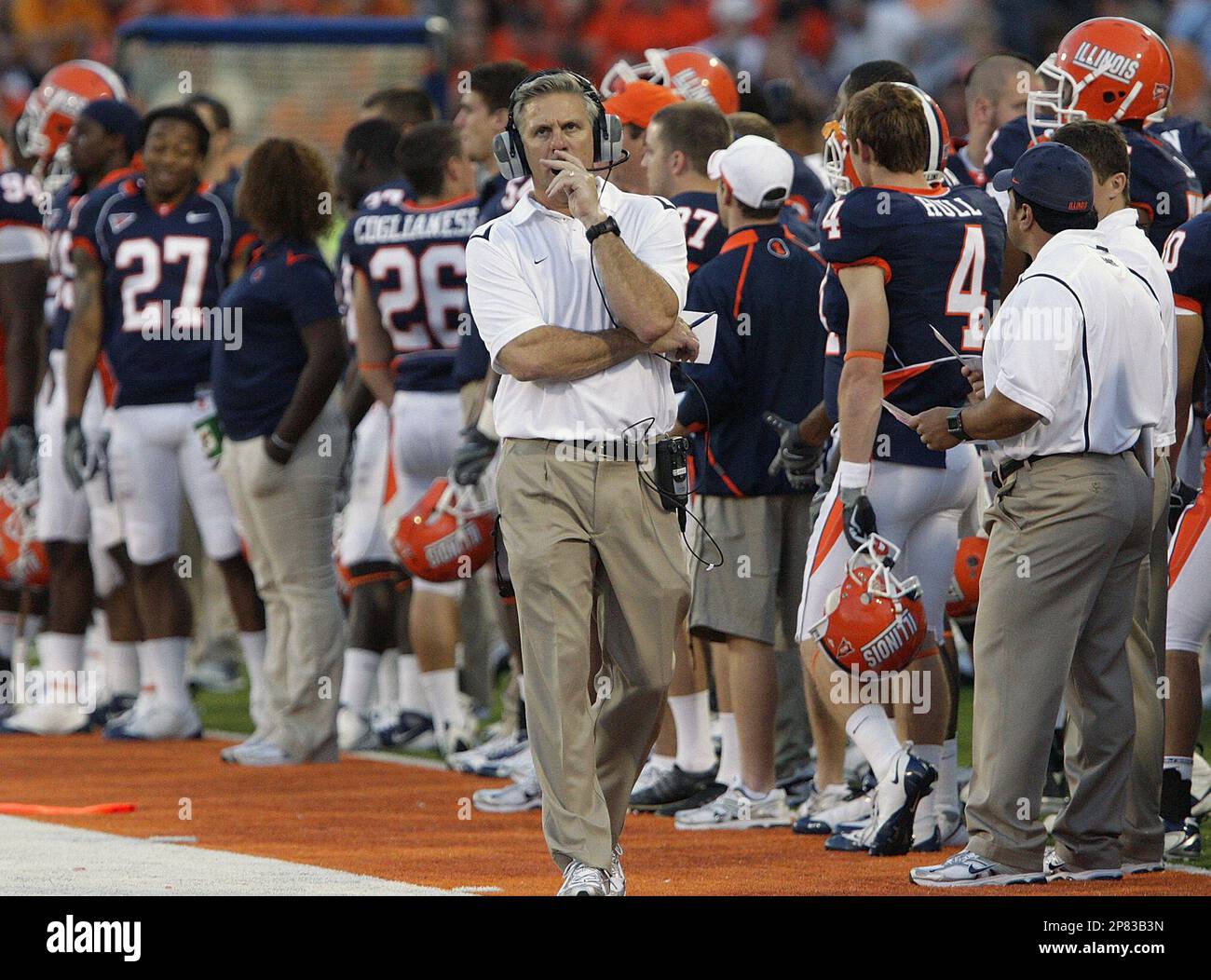 Illinois' head coach Ron Zook, center, looks on as his team defeats ...