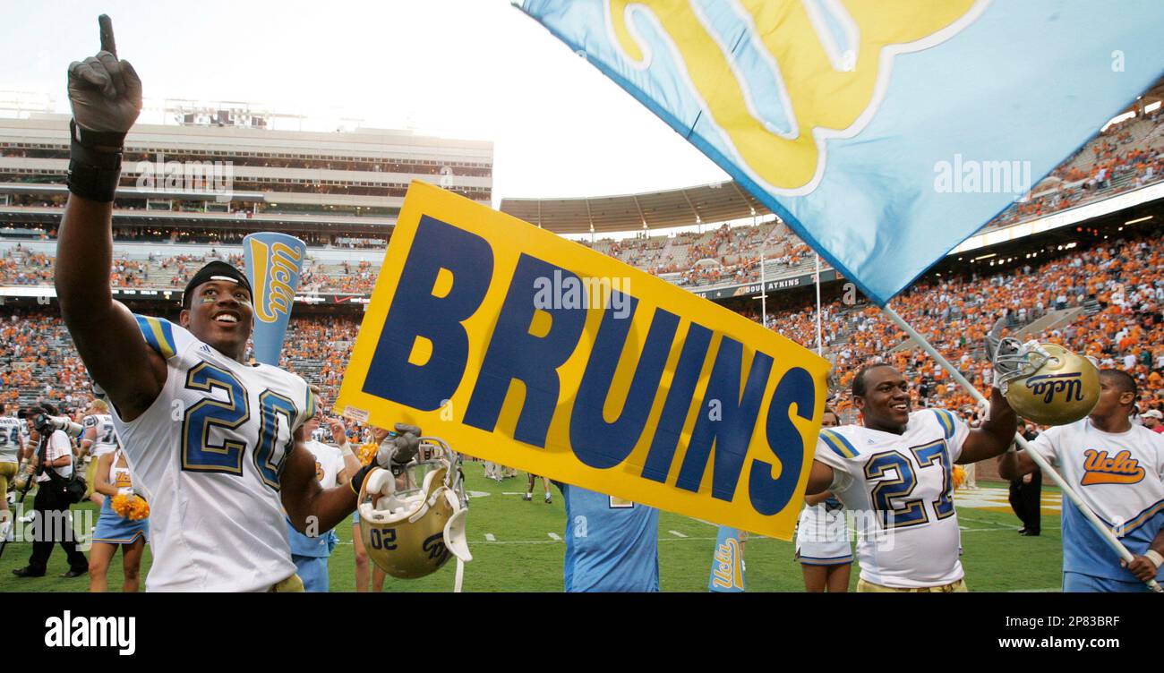 UCLA players Glenn Love (20) and Aaron Ware (27) celebrate their teams ...