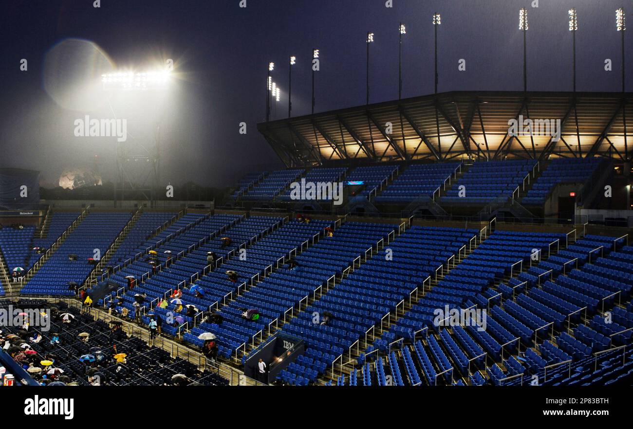 Arthur Ashe Stadium is seen in the background as spectators in Louis ...