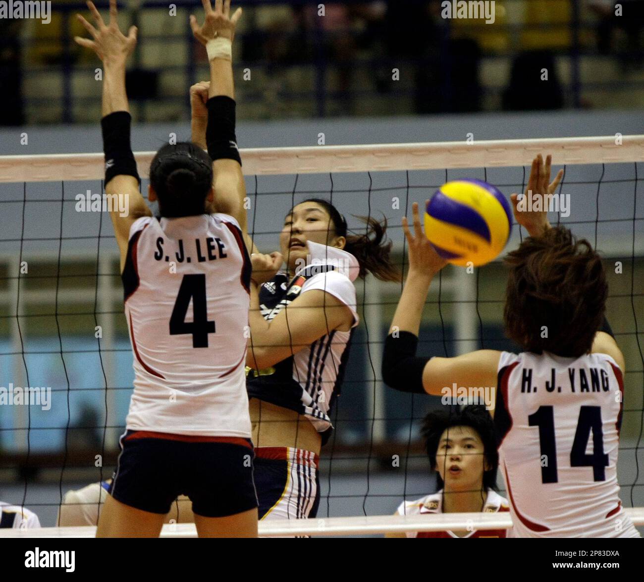 South Korea's Lee Sook Ja (4) and Yang Hyo Jin (14) jump to block the ...