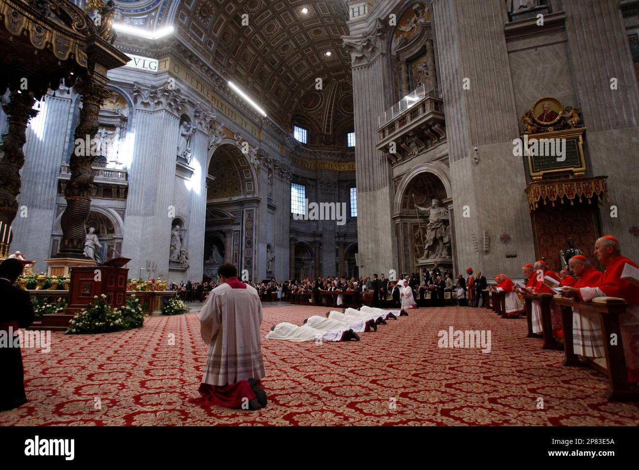 Newly ordained Bishops lay face down as they pray during a ceremony ...