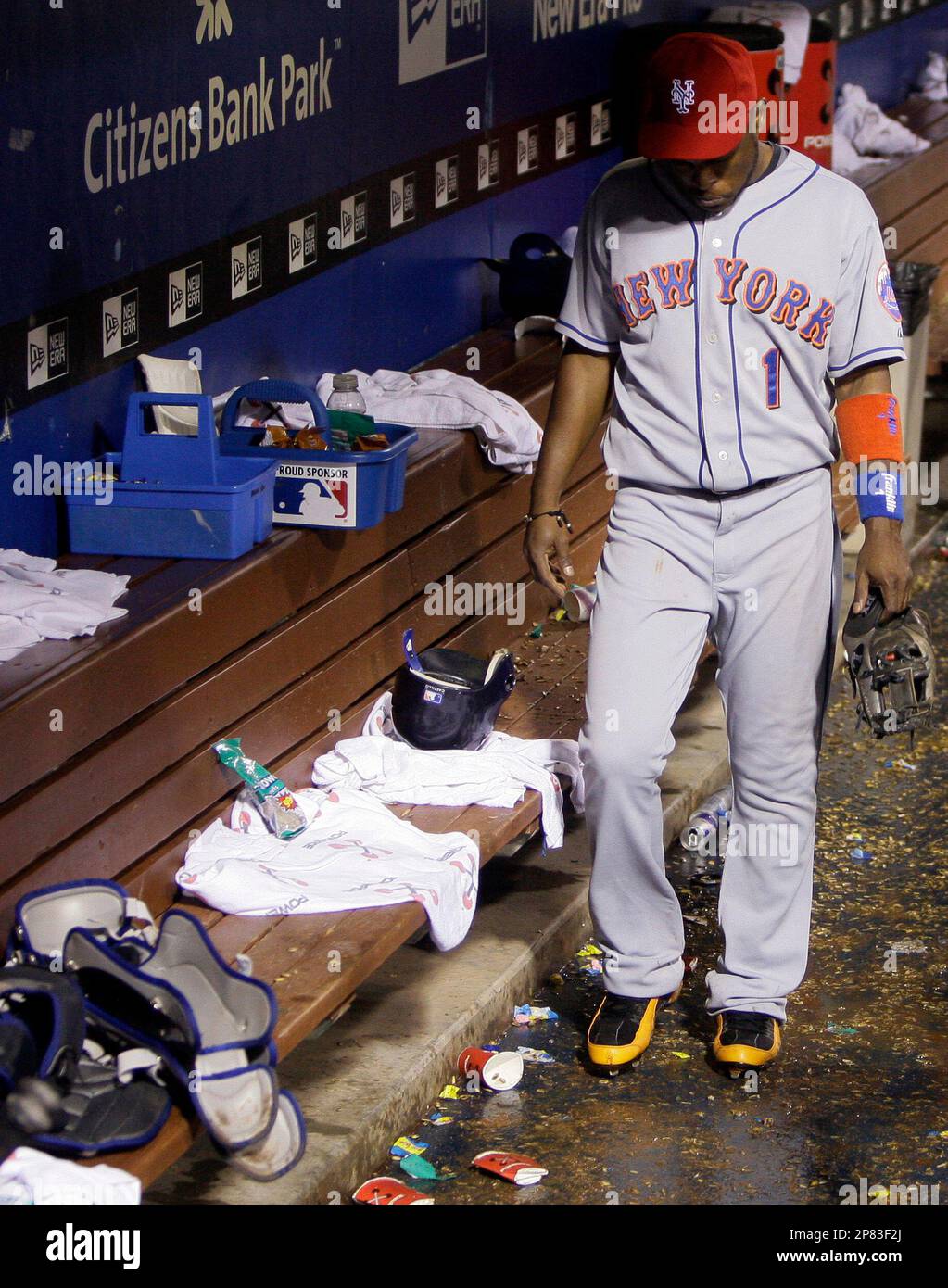 New York Mets second baseman Luis Castillo walks through the dugout ...