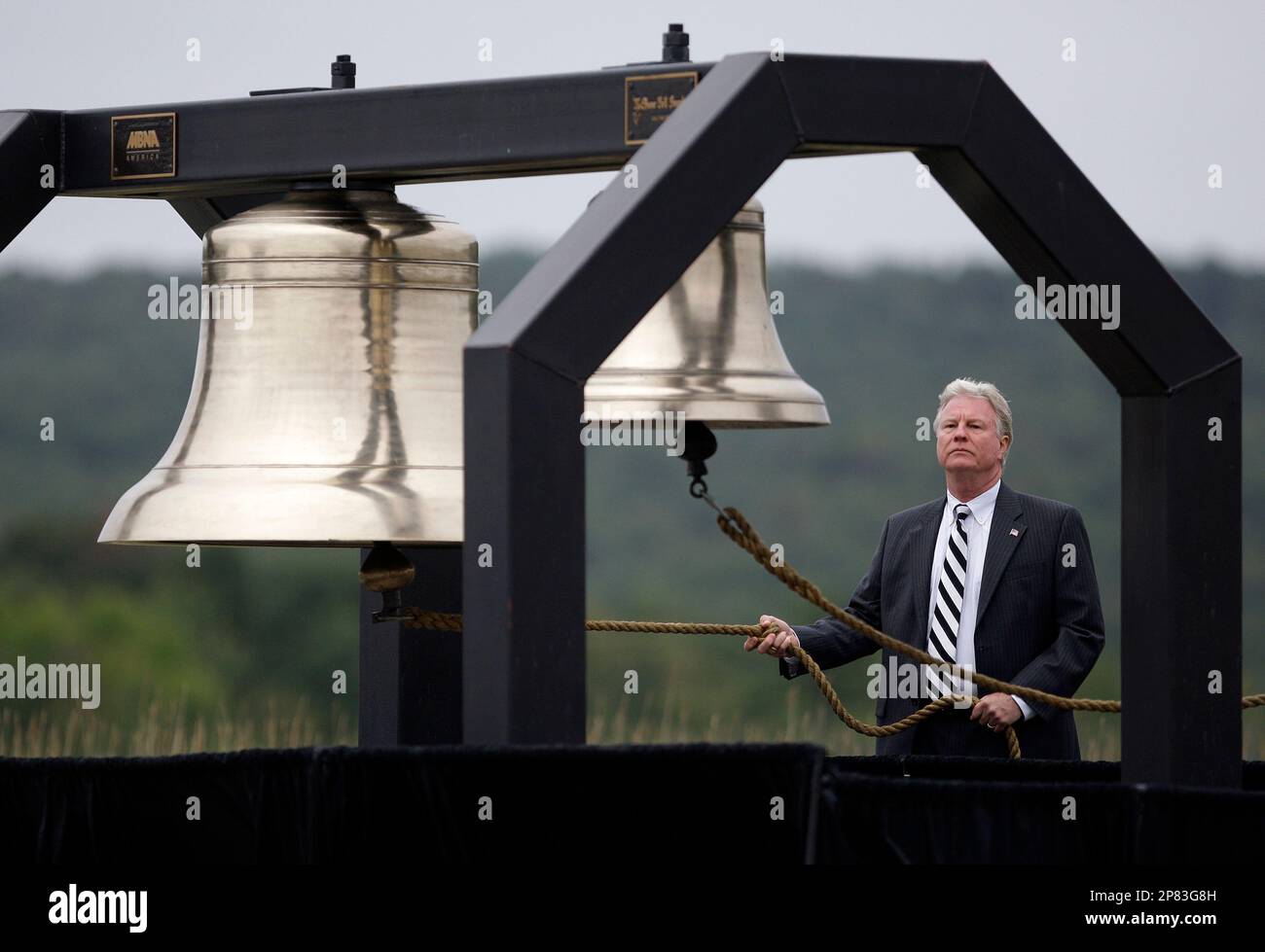 Wells Morrison with the FBI rings the large bell during the name ...