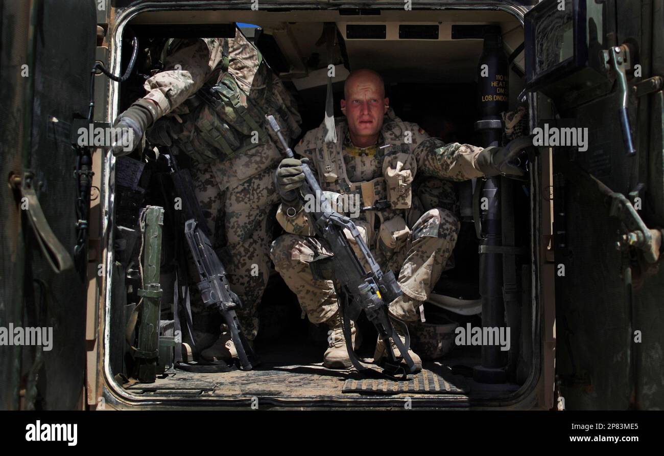 A German International Security Assistance Force, ISAF, soldier, and ...