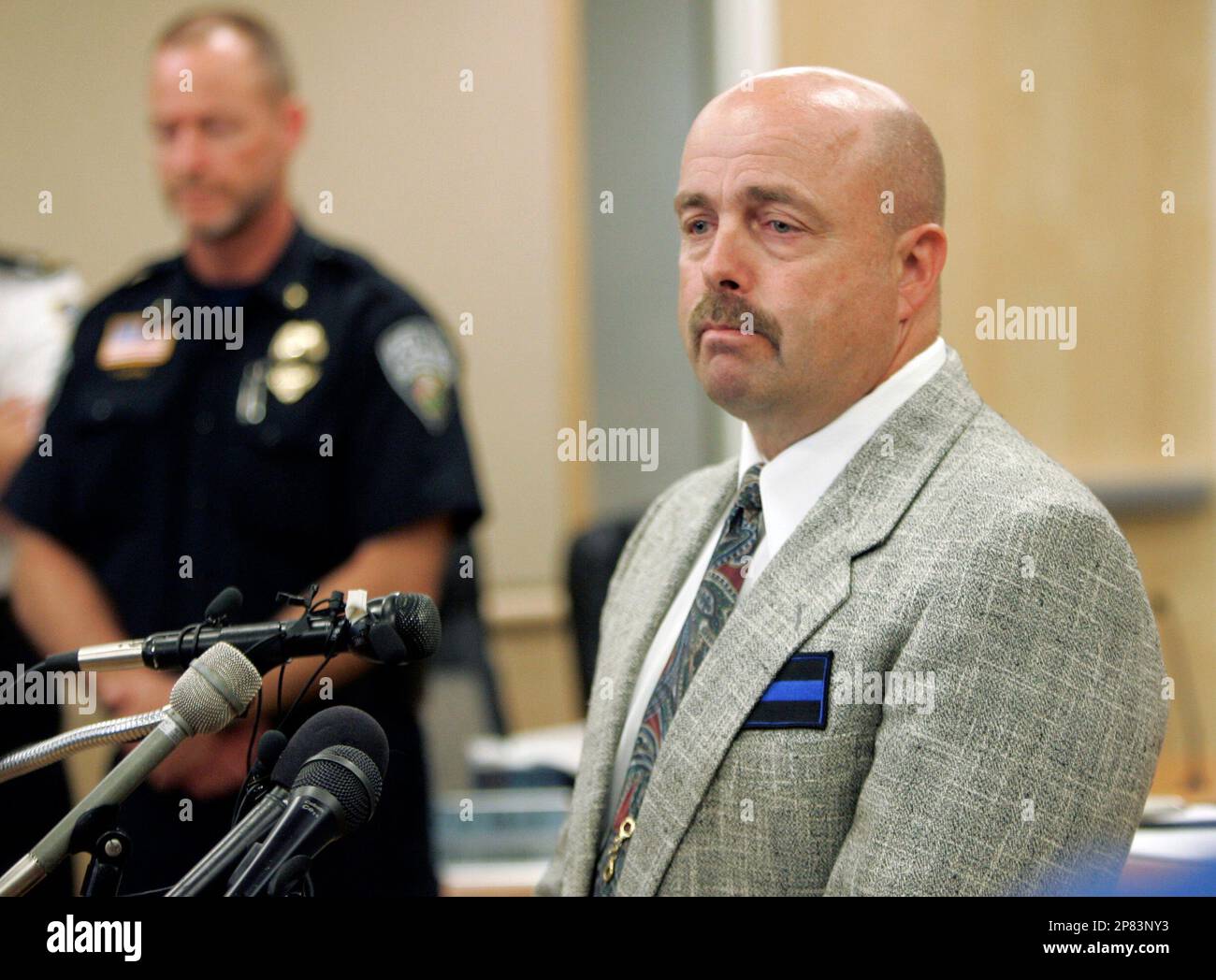 Paul Ebert, right, pauses a moment Wednesday, Sept. 9, 2009 in North St ...