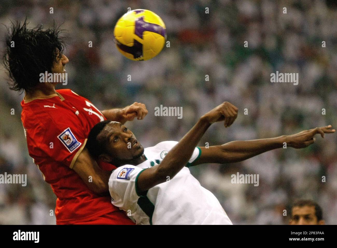 Saudi Arabia's Saud Kariri, right, challenges Bahrain's Mohamad Husain ...