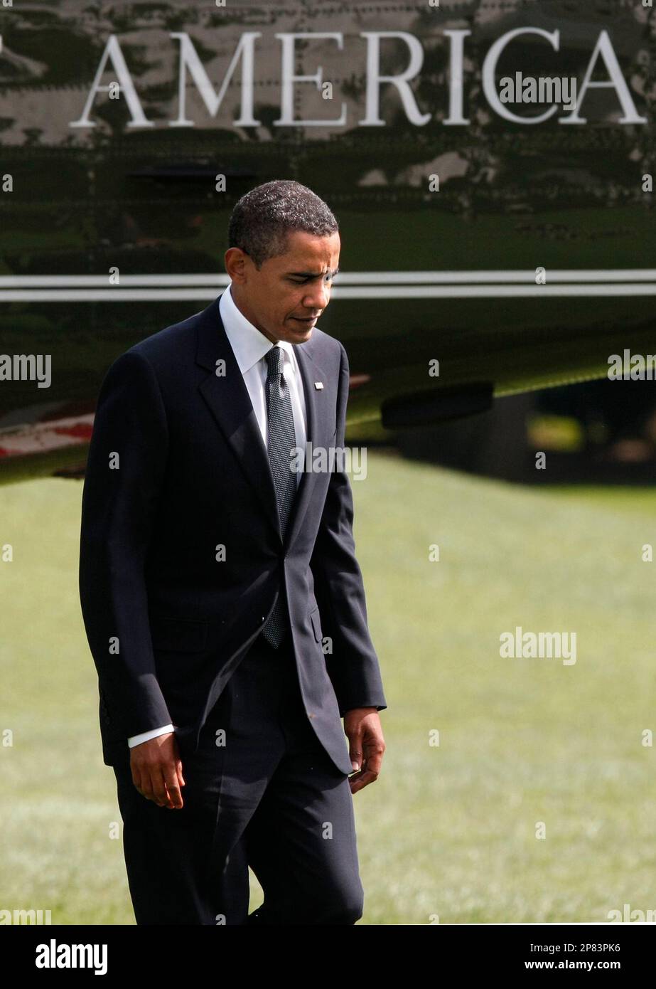 President Barack Obama walks to the Oval Office of the White House in ...