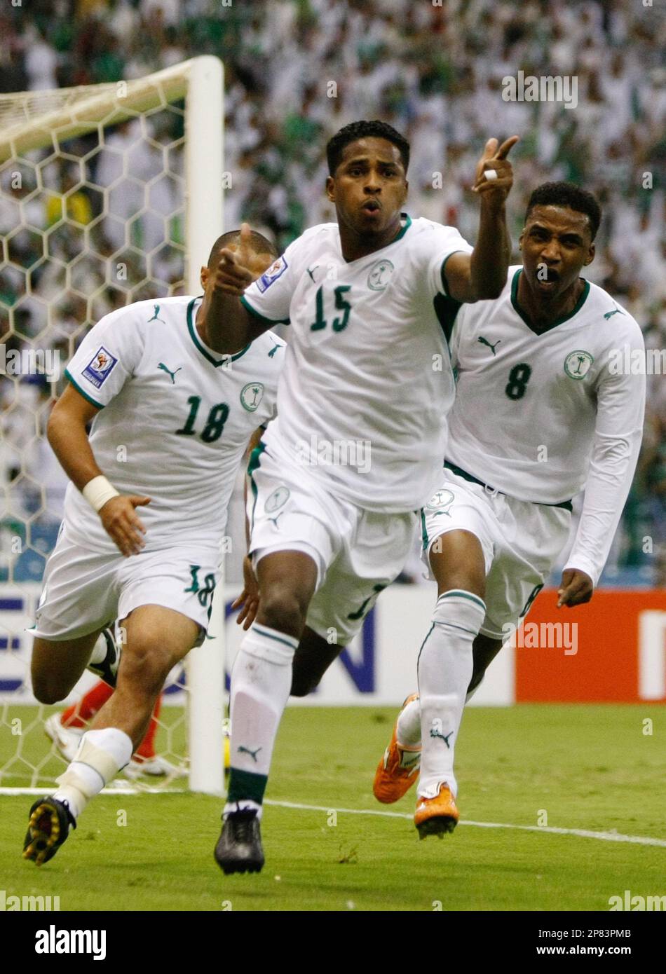 Saudi Arabia's Nasir Al Shamrani, center, celabrates with his teammates ...
