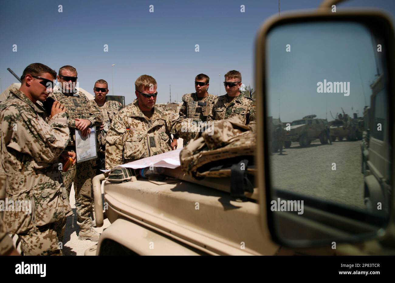 German ISAF soldiers, members of the Quick Reaction Force (QRF), get ...
