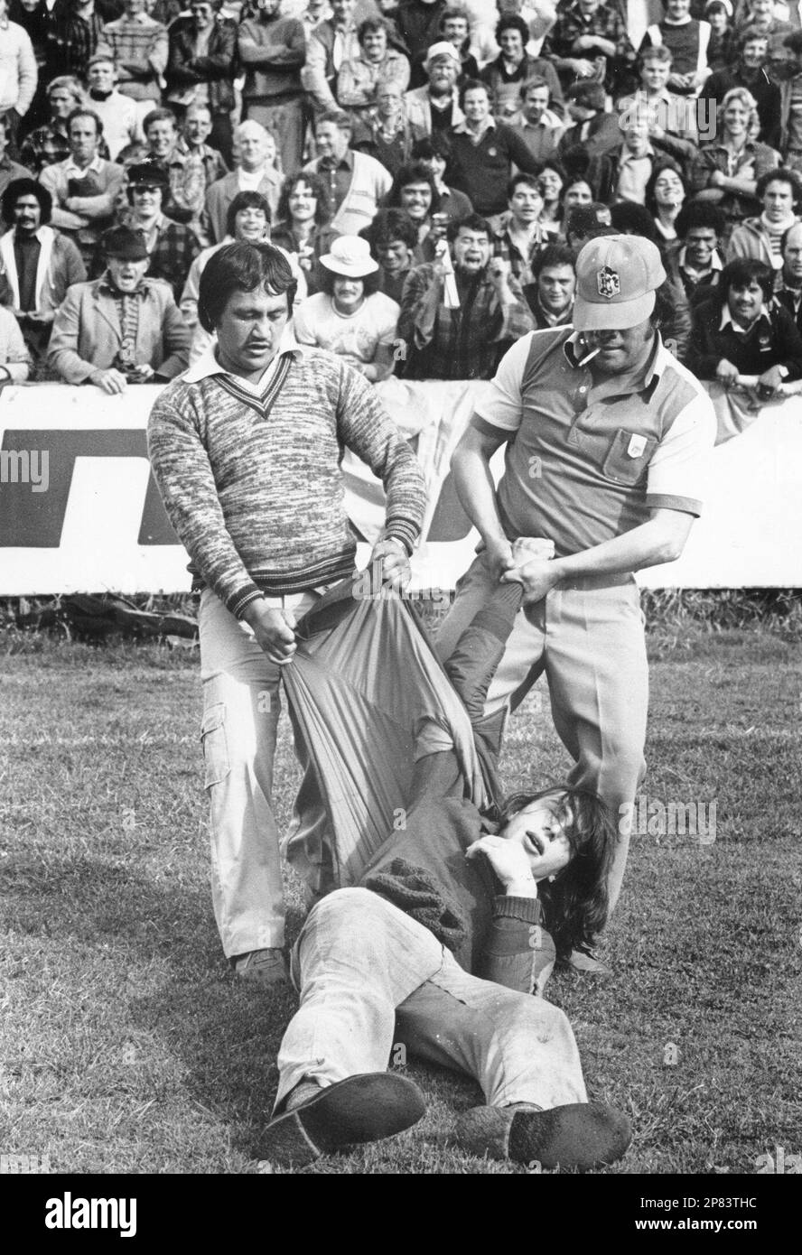 In this July 25, 1981 photo, a pair of rugby union supporters drag away ...