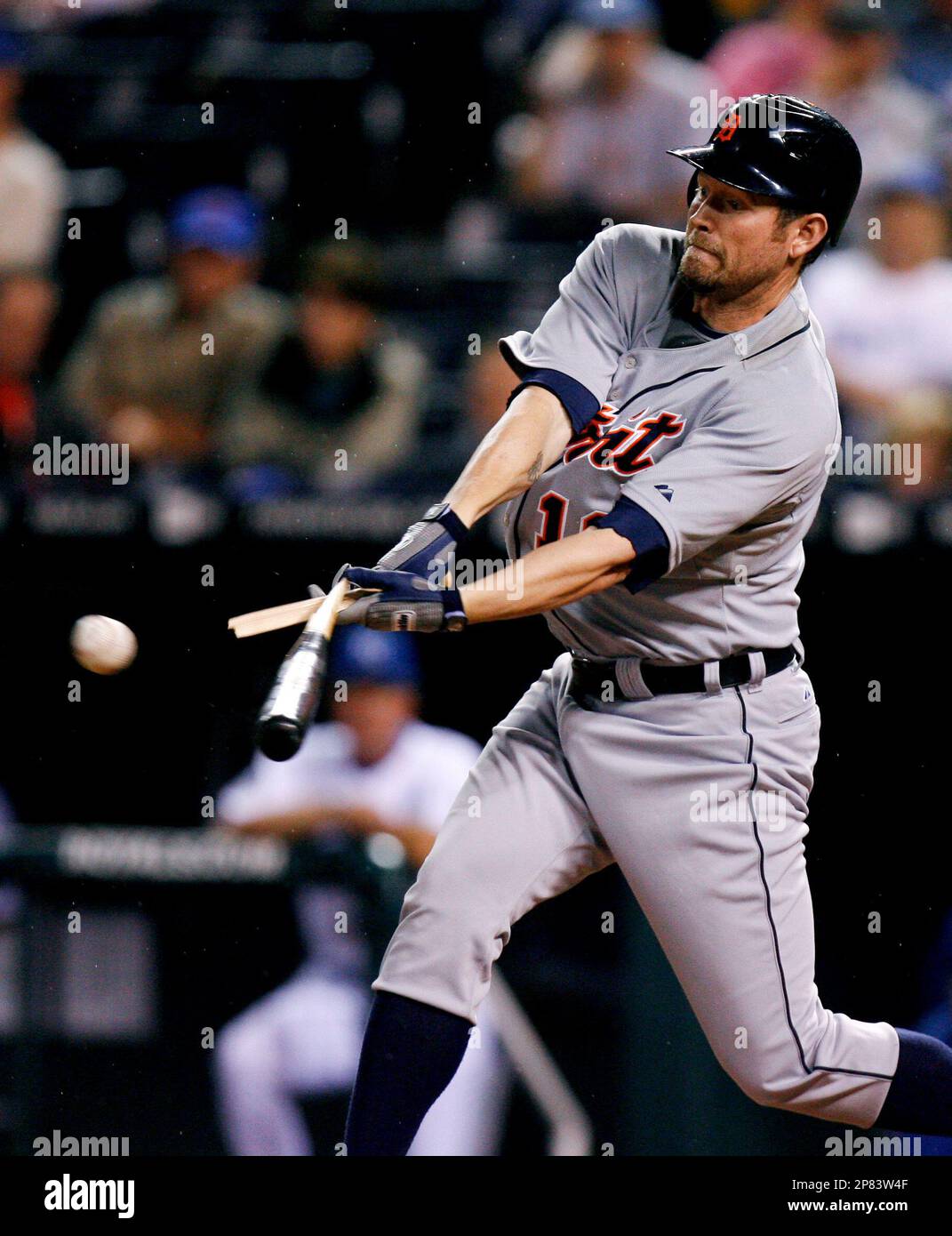 Detroit Tigers' Aubrey Huff breaks his bat as he drives the ball into ...