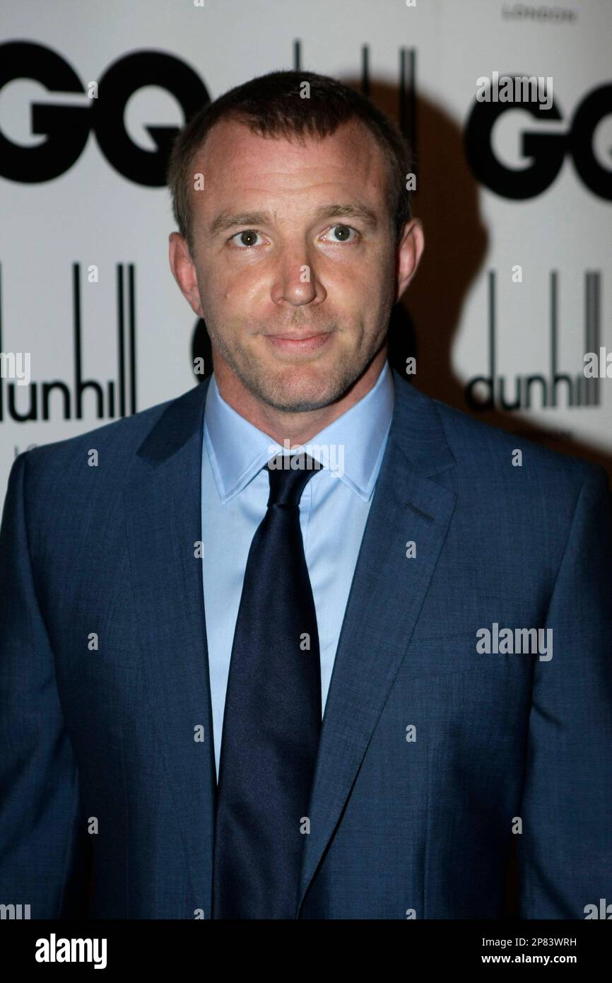 Film director Guy Ritchie poses for photographs as he arrives at the ...
