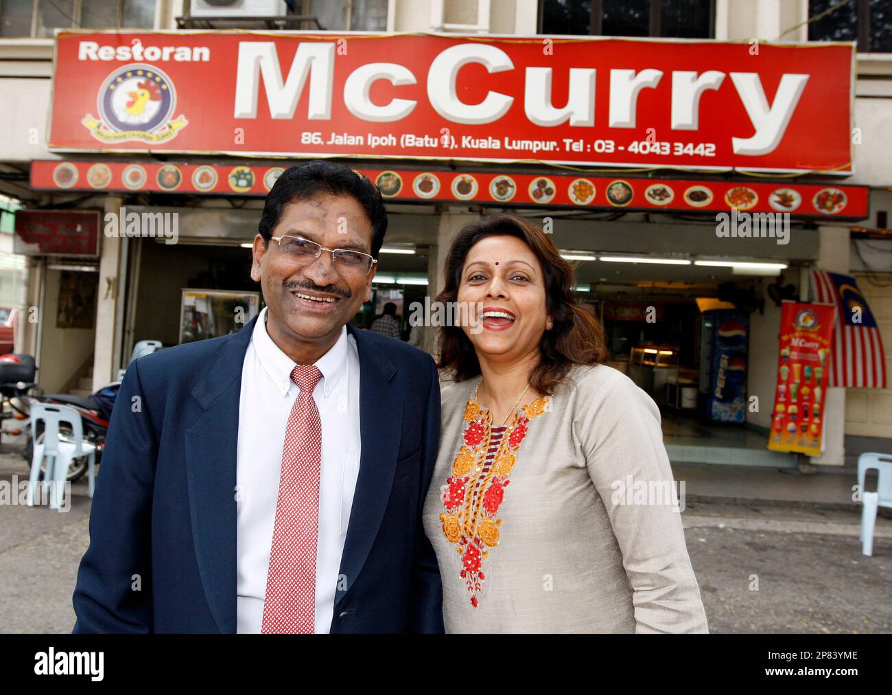 McCurry restaurant owner A.M.S.P. Suppiah and his wife Kanageswary pose ...
