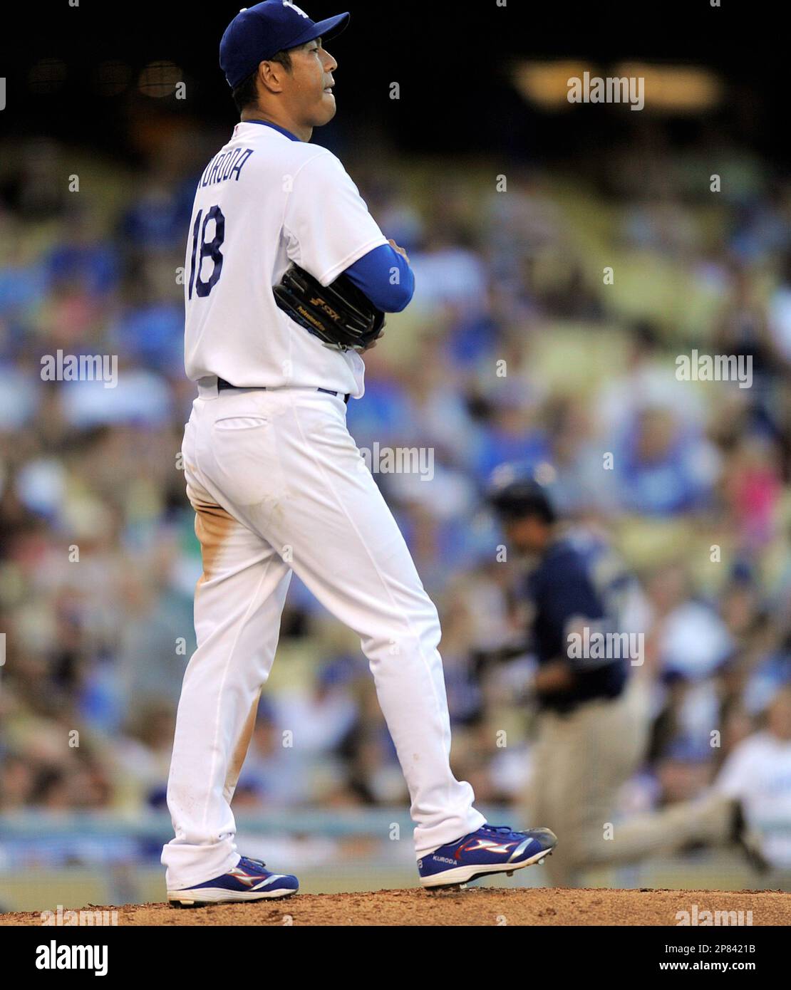 Los Angeles Dodgers starting pitcher Hiroki Kuroda, of Japan, looks at ...