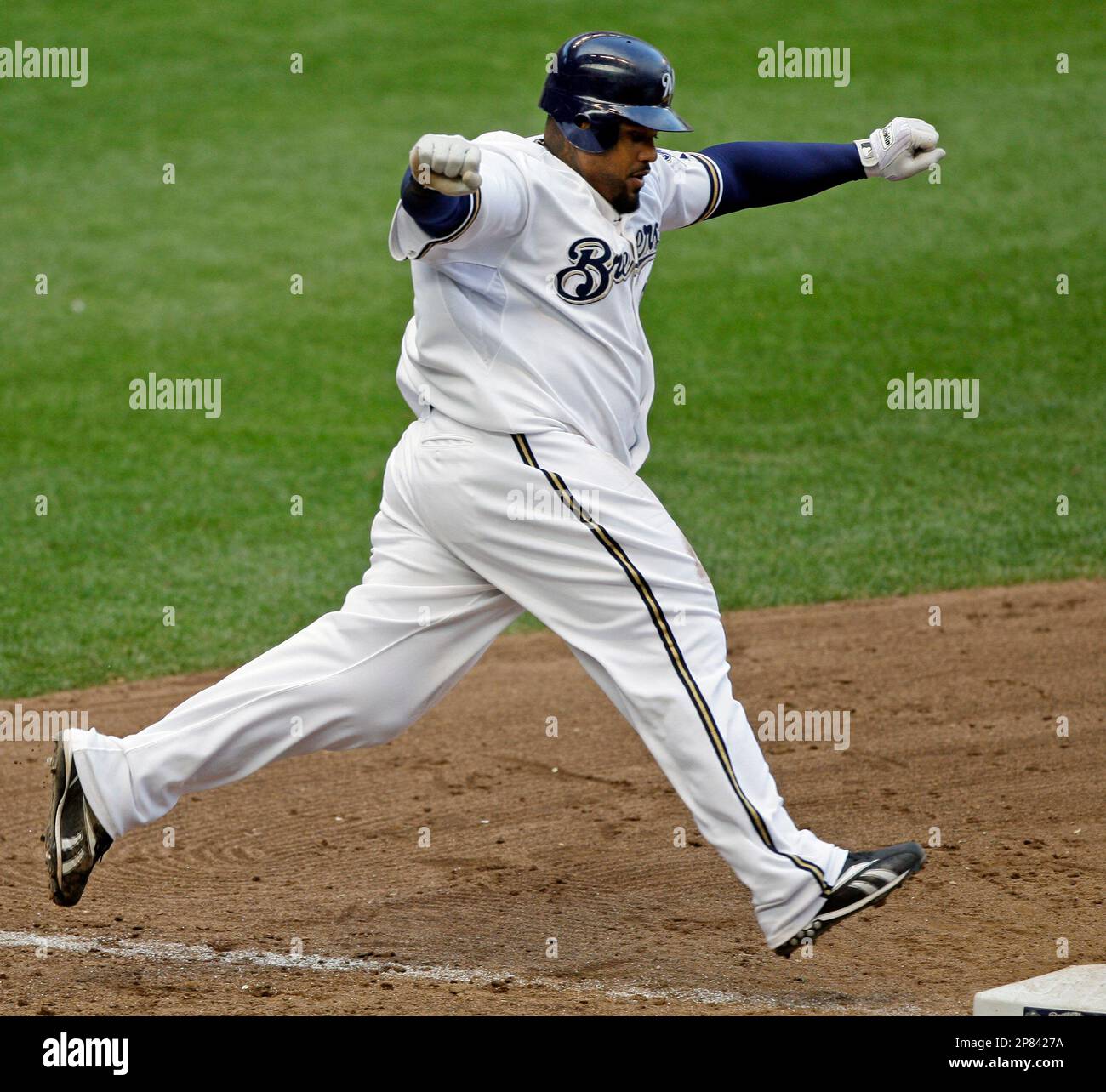 Milwaukee Brewers' Prince Fielder (28) reacts as he rounds first after ...