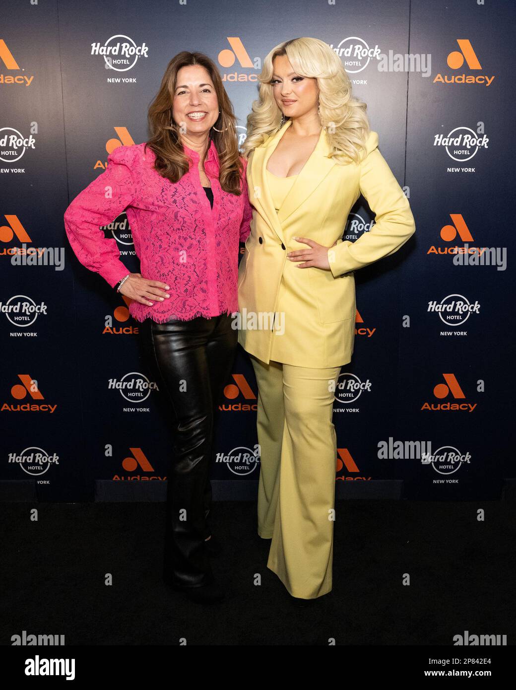 Audacy COO Susan Larkin and Bebe Rexha arrive on the red carpet for ...